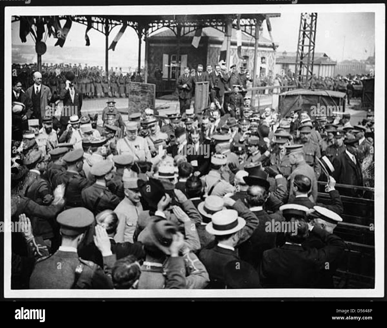 A crowd gathers on the gangway to greet General John J. Pershing as he ...