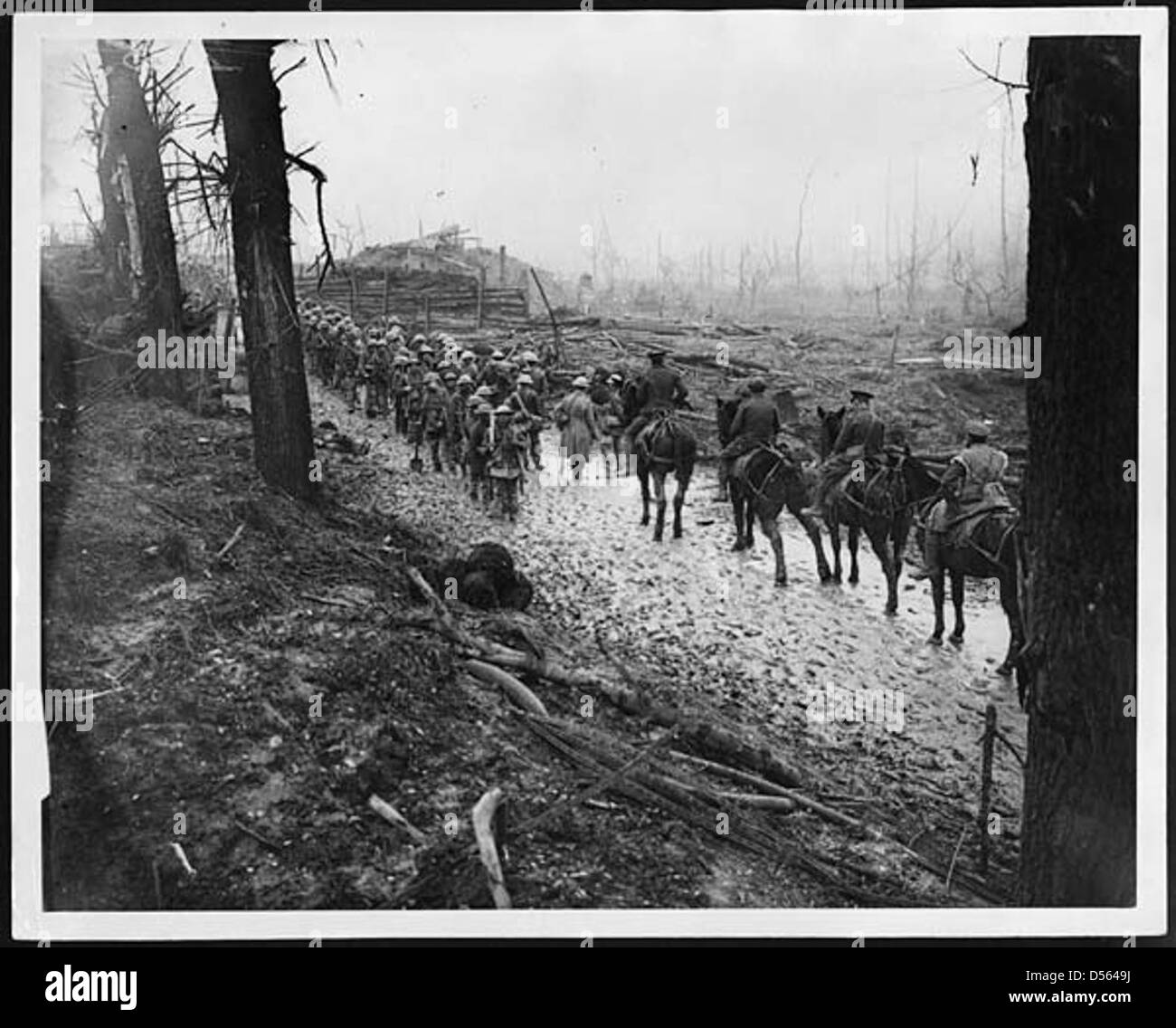A scene depicting soldiers moving along a road during World War I. The ...