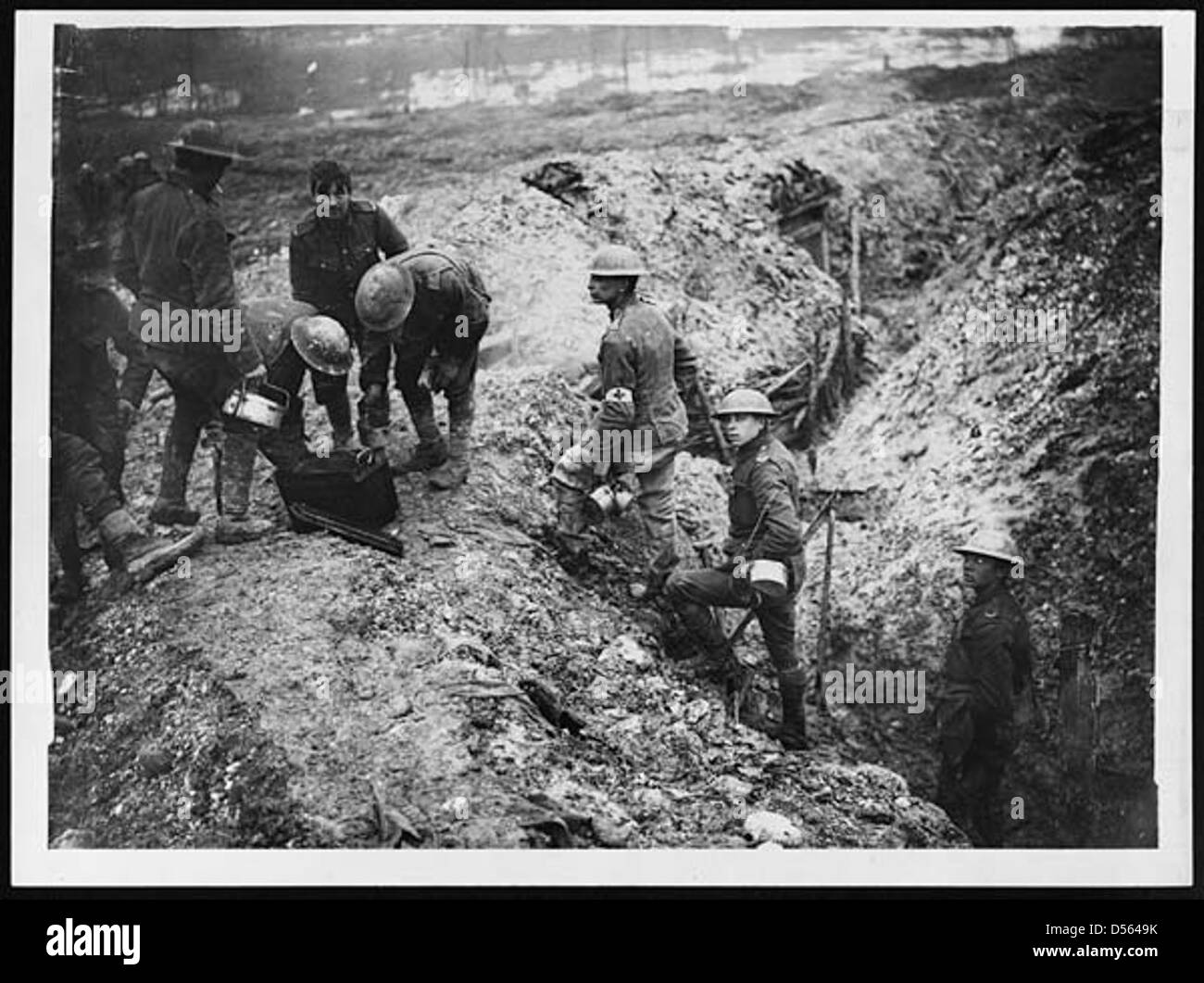 Soldiers enjoy a meal in a reserve trench, providing a brief respite ...