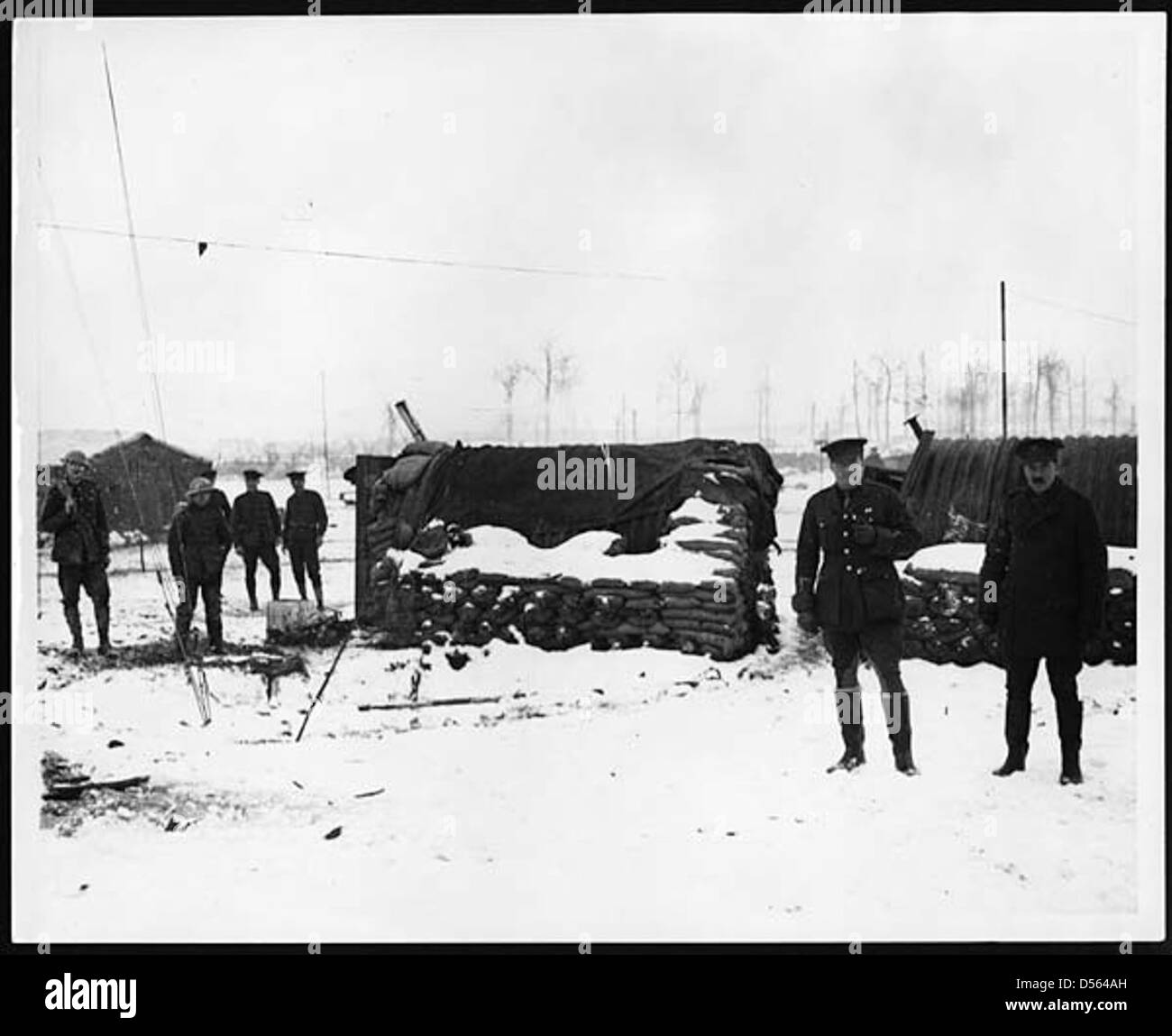 Two large dug-outs, built by soldiers in the snow, serve as shelters ...