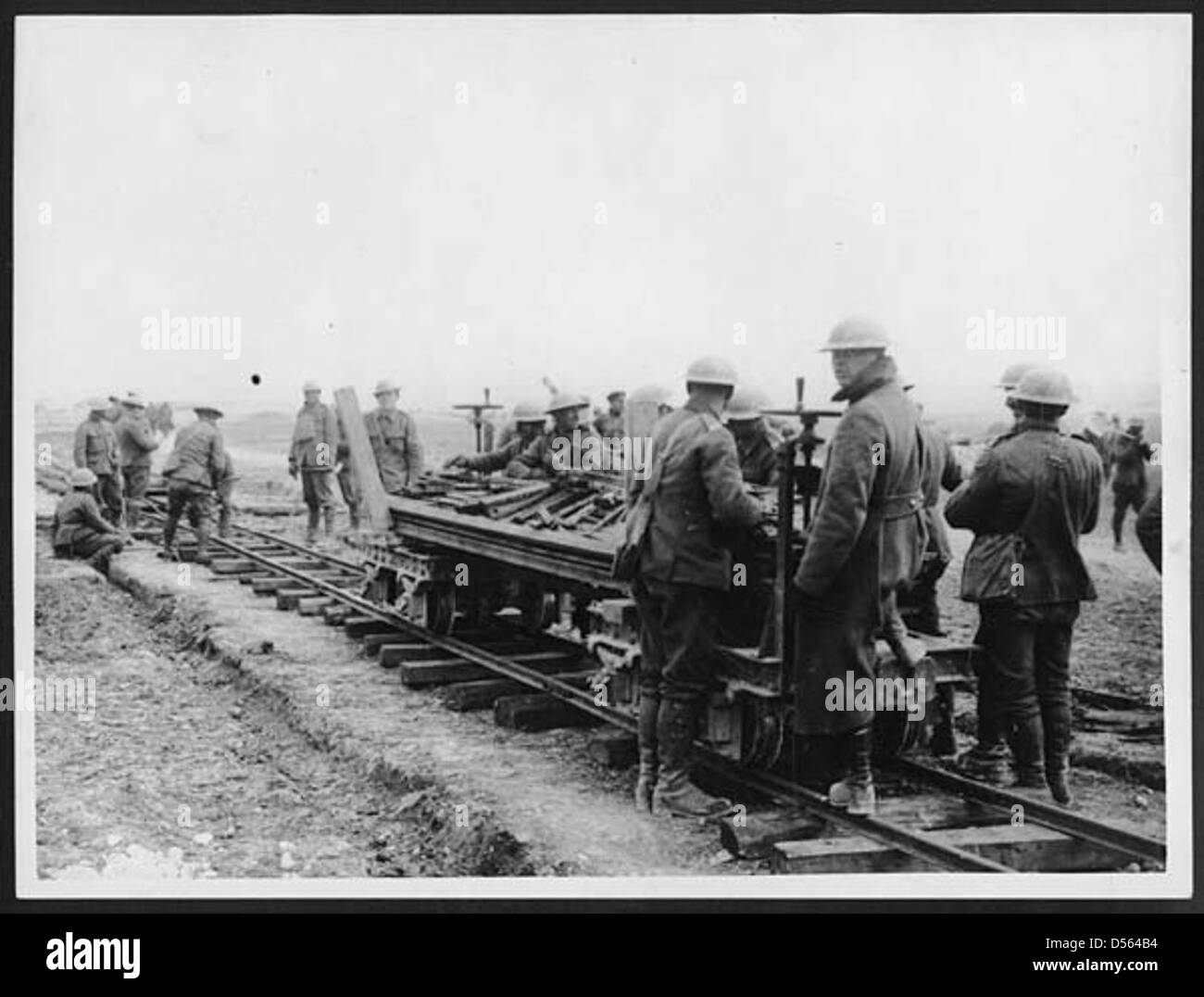 Soldiers constructing a light railway during World War I. These ...
