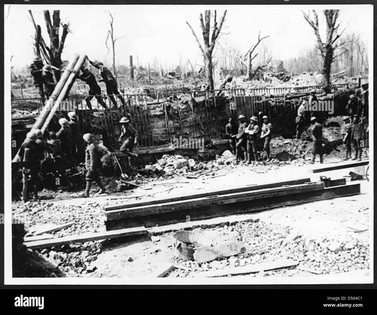 Soldiers clear a road through a captured village, highlighting the ...