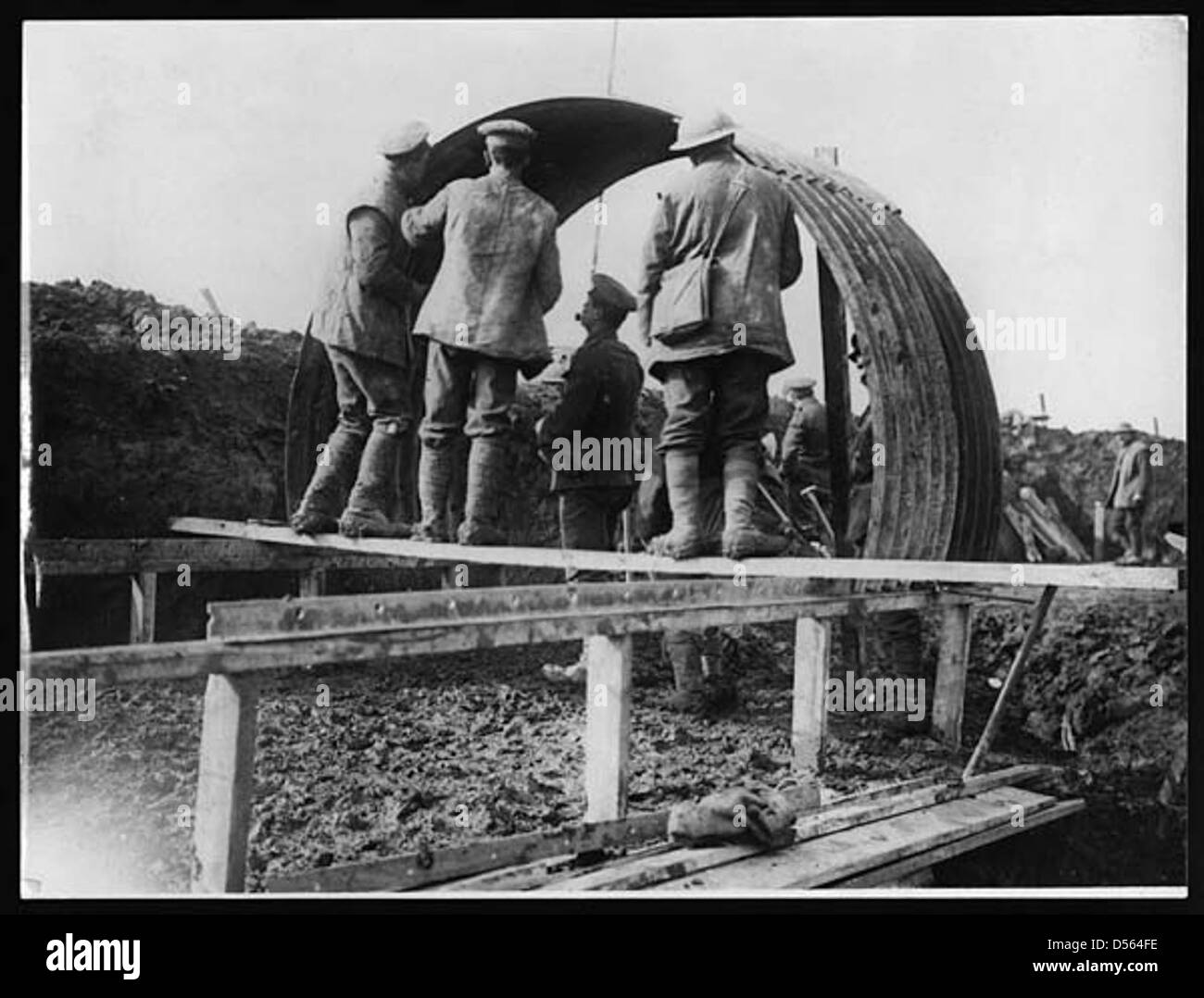 Soldiers work to construct a hut on newly captured territory ...