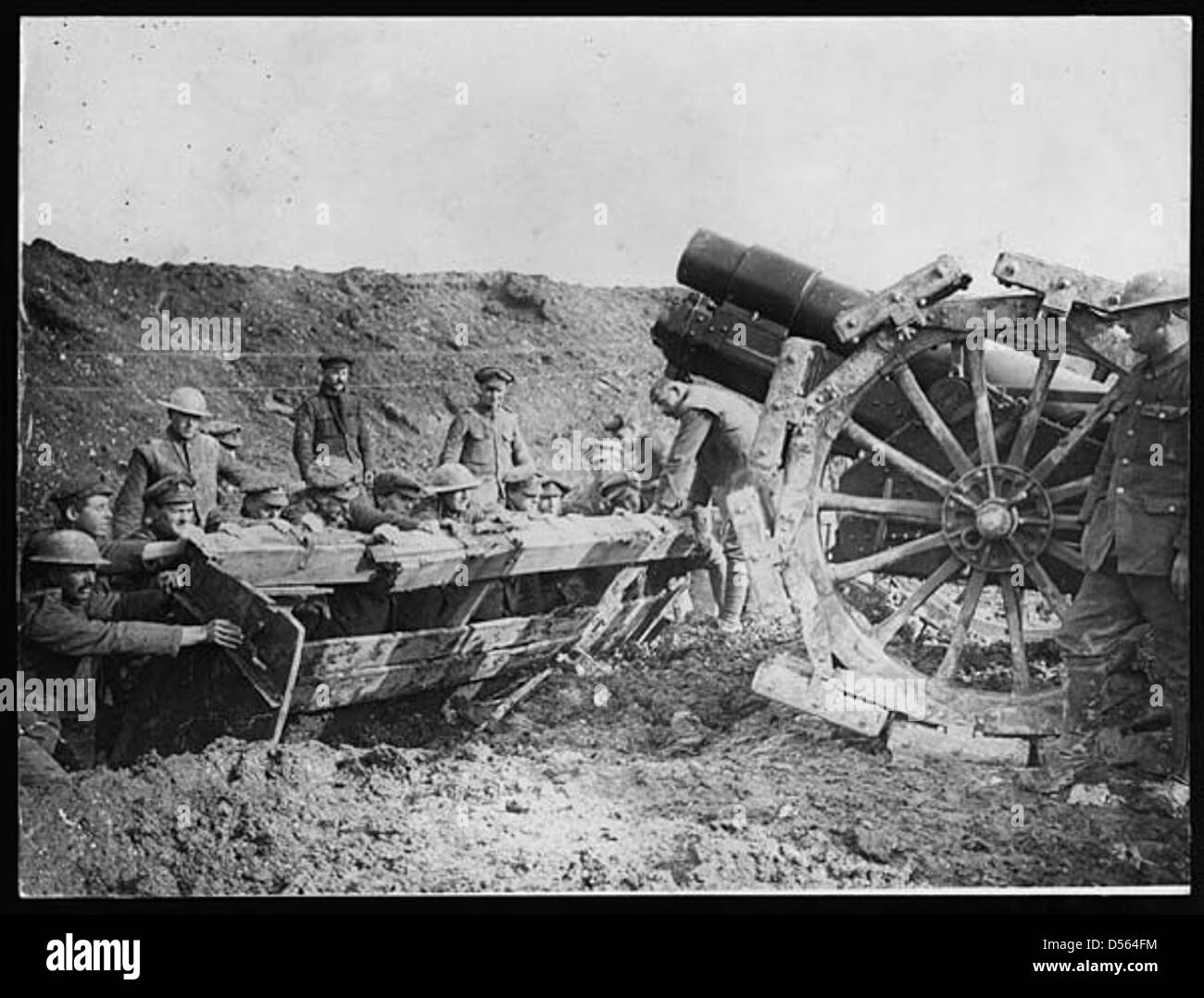Soldiers clearing the ground to establish a Howitzer position during ...