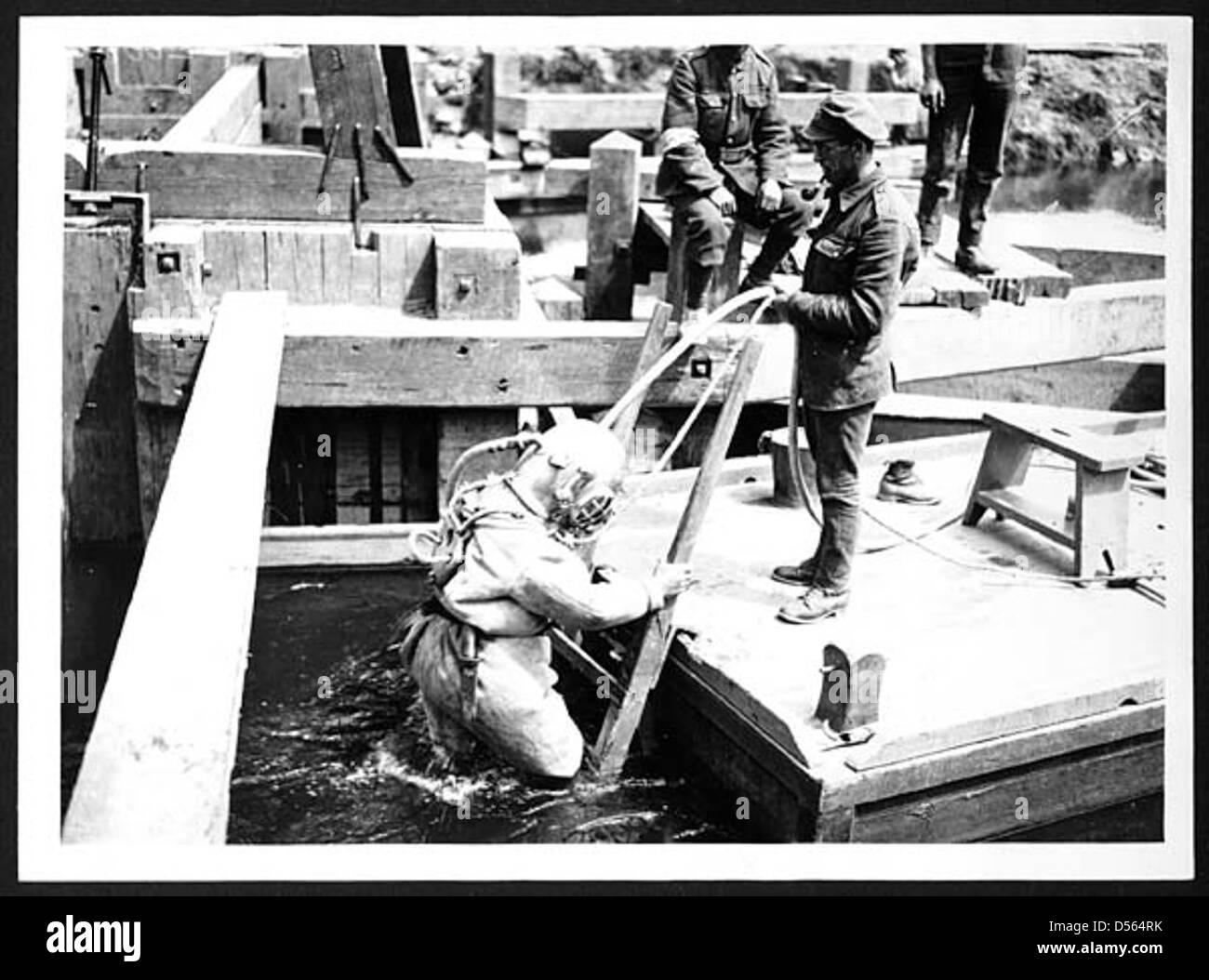A Royal Engineers diver descends into a canal in France to repair a ...