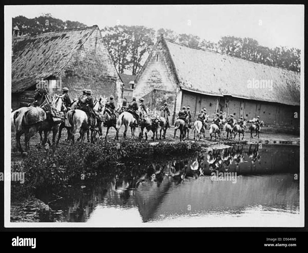 The Royal Scots Greys, a cavalry regiment, riding through a village ...