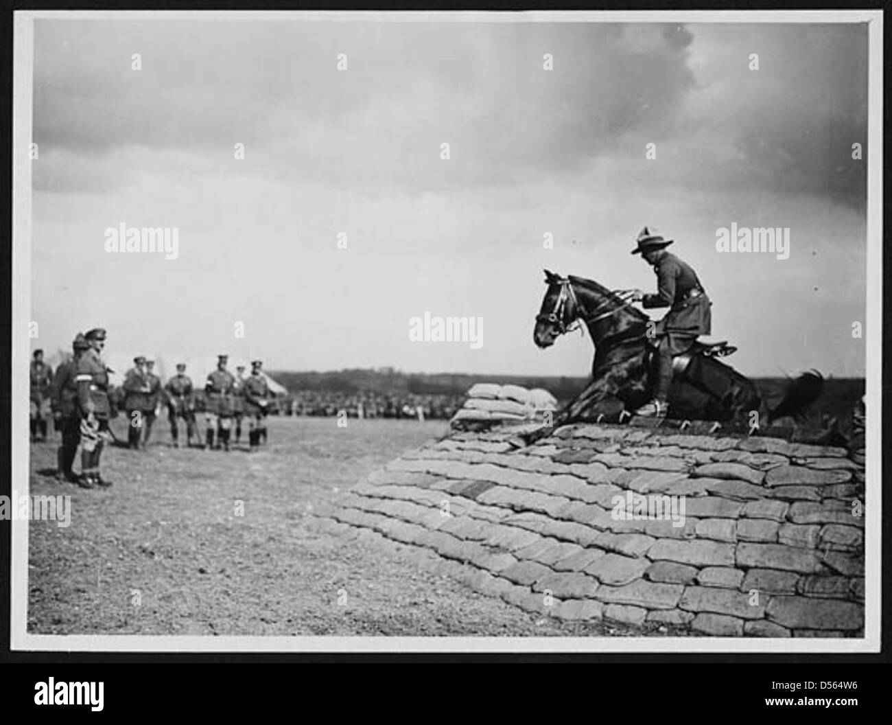 A soldier examines the battlefield from a safe distance before ...