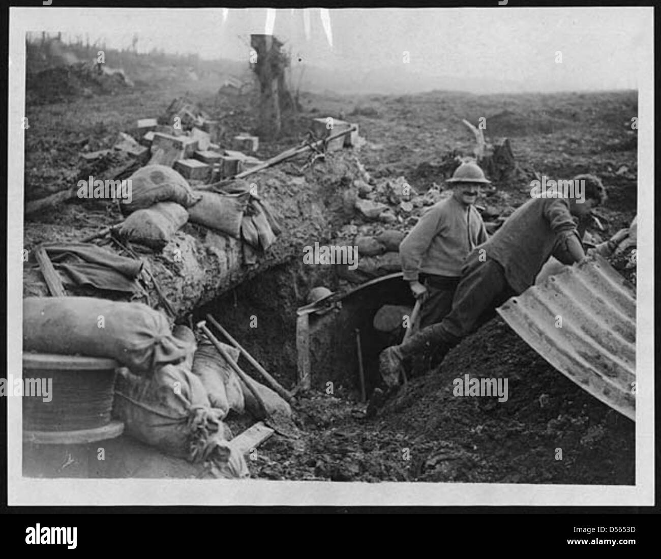 Soldiers constructing a new dugout while advancing during World War I ...