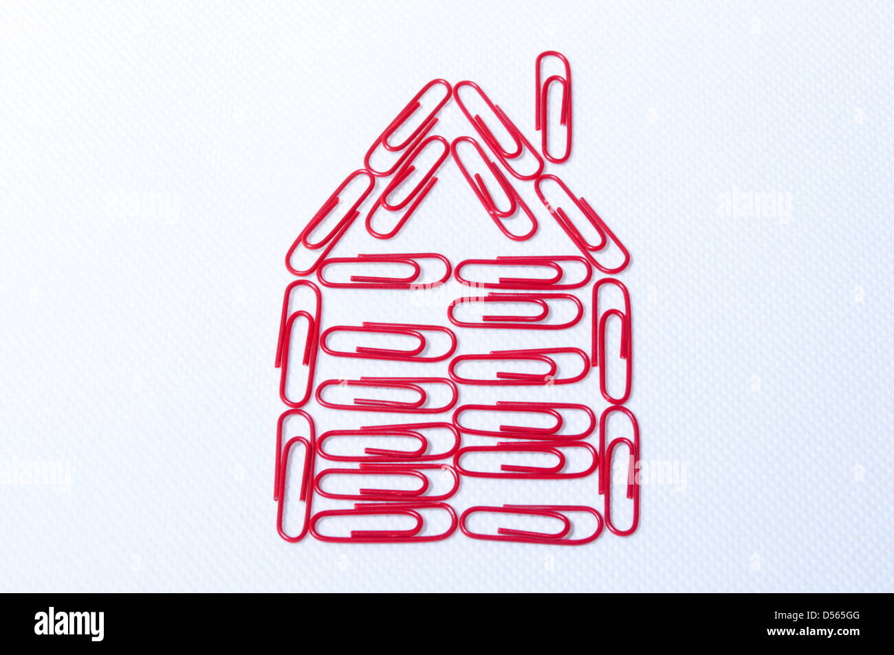 design a house with red paper clips on the white background Stock Photo ...