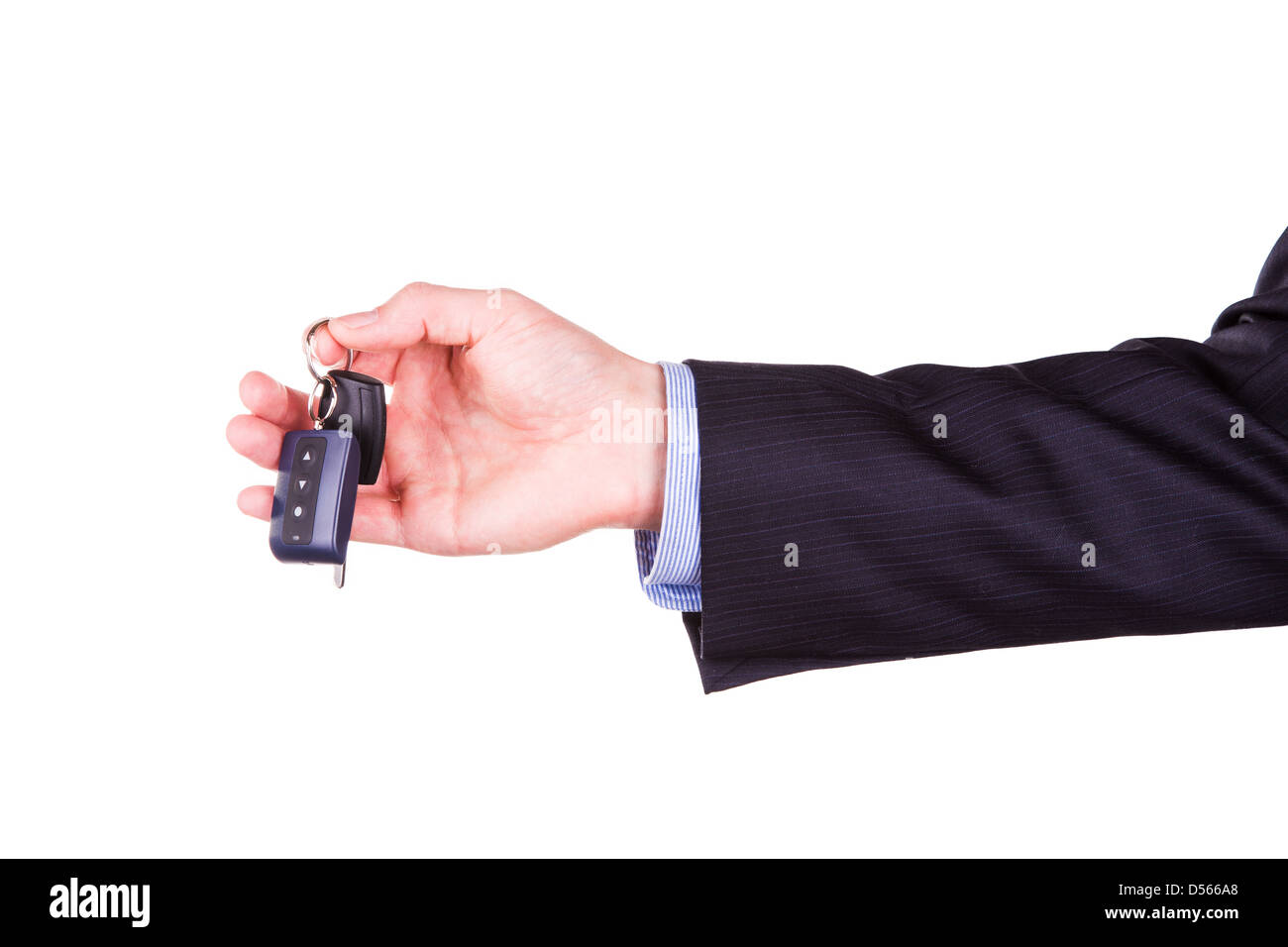 Male hand holding a car key isolated on white background. New car ...