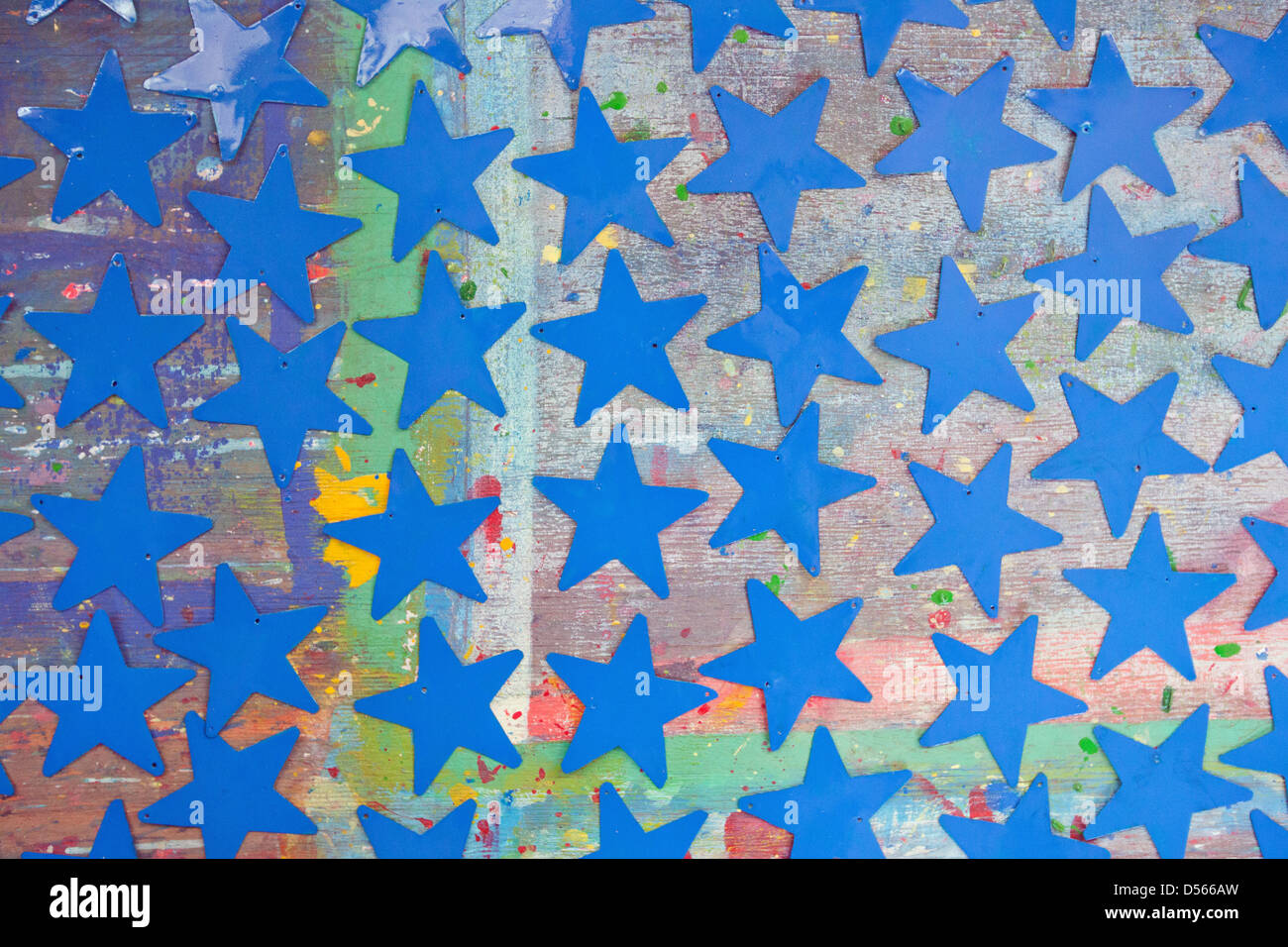 Metal stars painted blue on a workshop work surface Stock Photo - Alamy