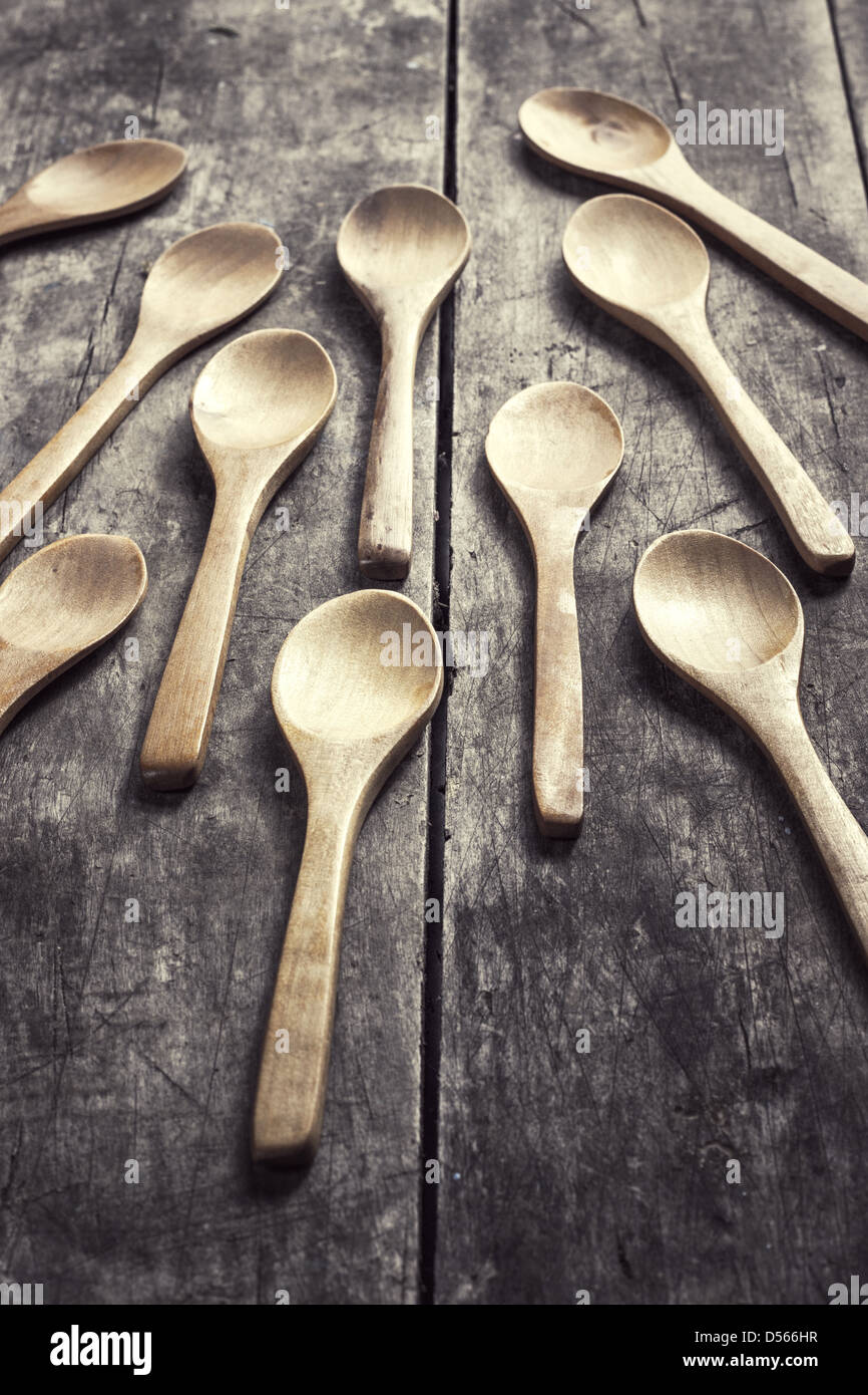 Wooden spoon lying on a table Stock Photo - Alamy