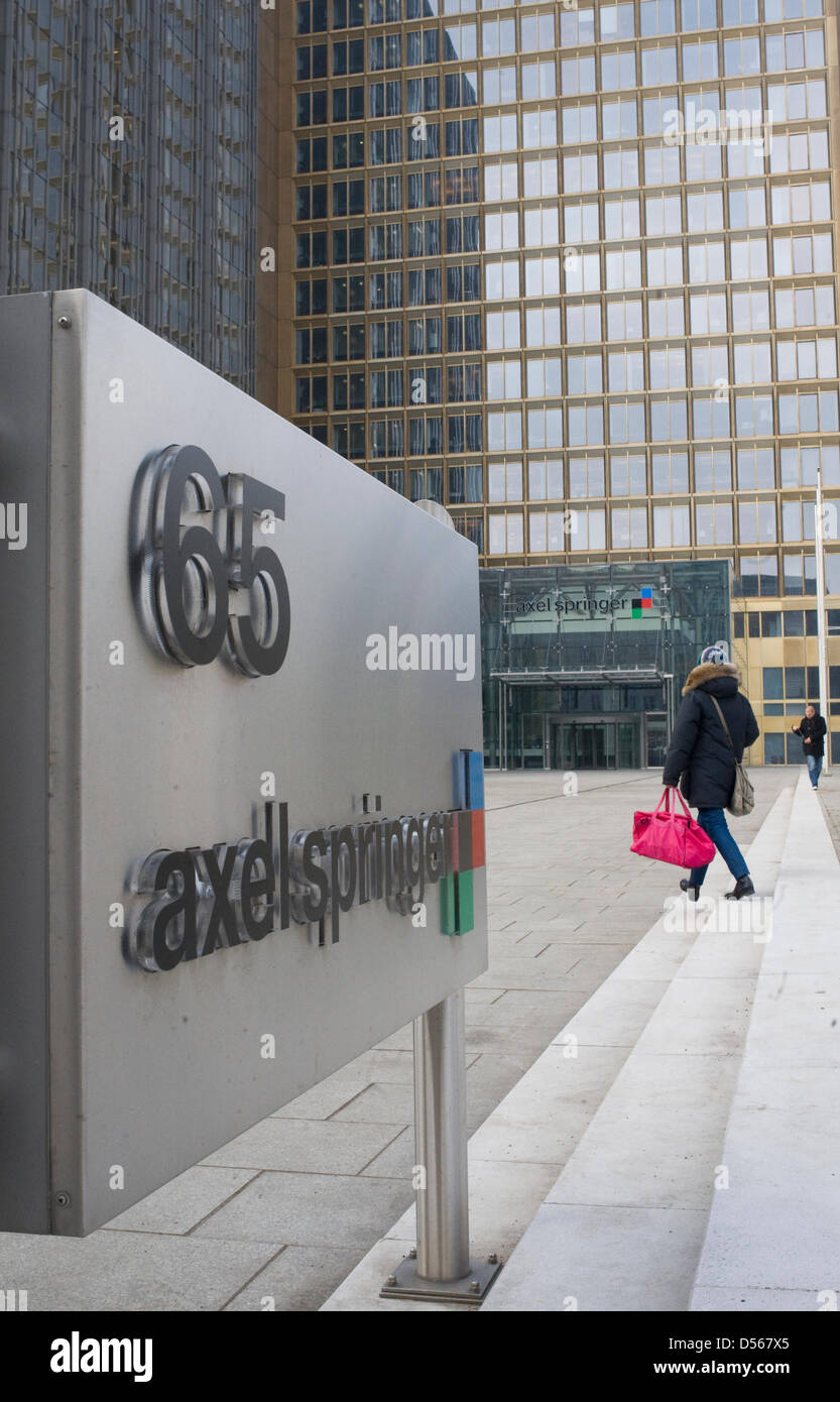 A woman arrives at the Axel Springer AG in Berlin, Germany, 10 March ...
