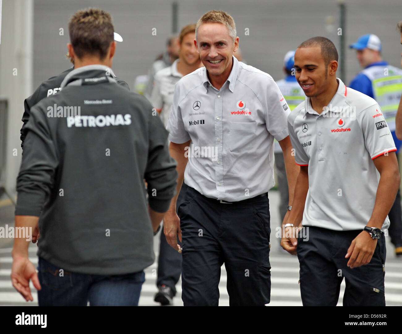 Britain's Lewis Hamilton of McLaren Mercedes (R) talks with McLaren ...