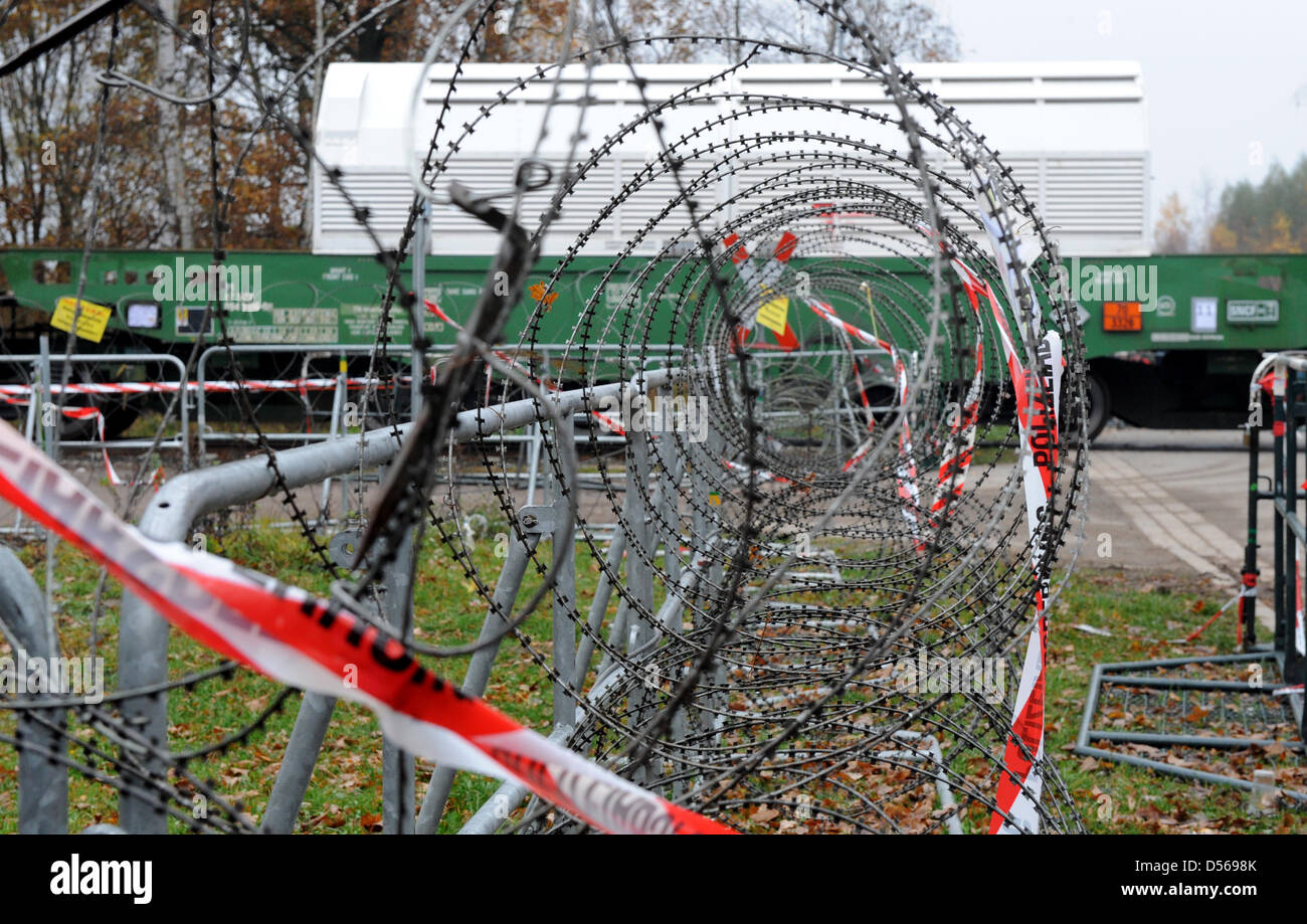Police officers in riot gear guard the CASTOR transport arriving in ...