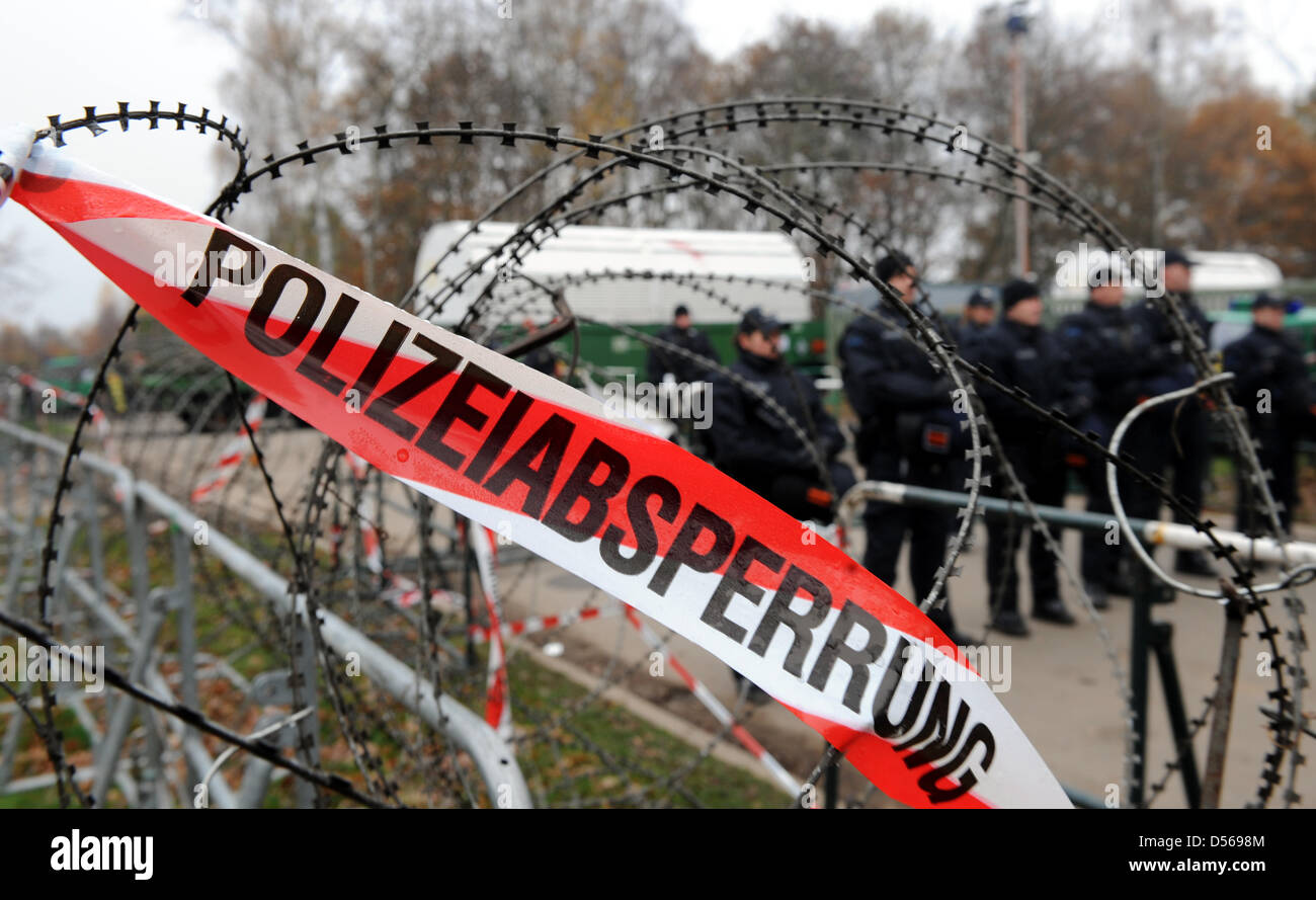 Police officers in riot gear guard the CASTOR transport arriving in ...