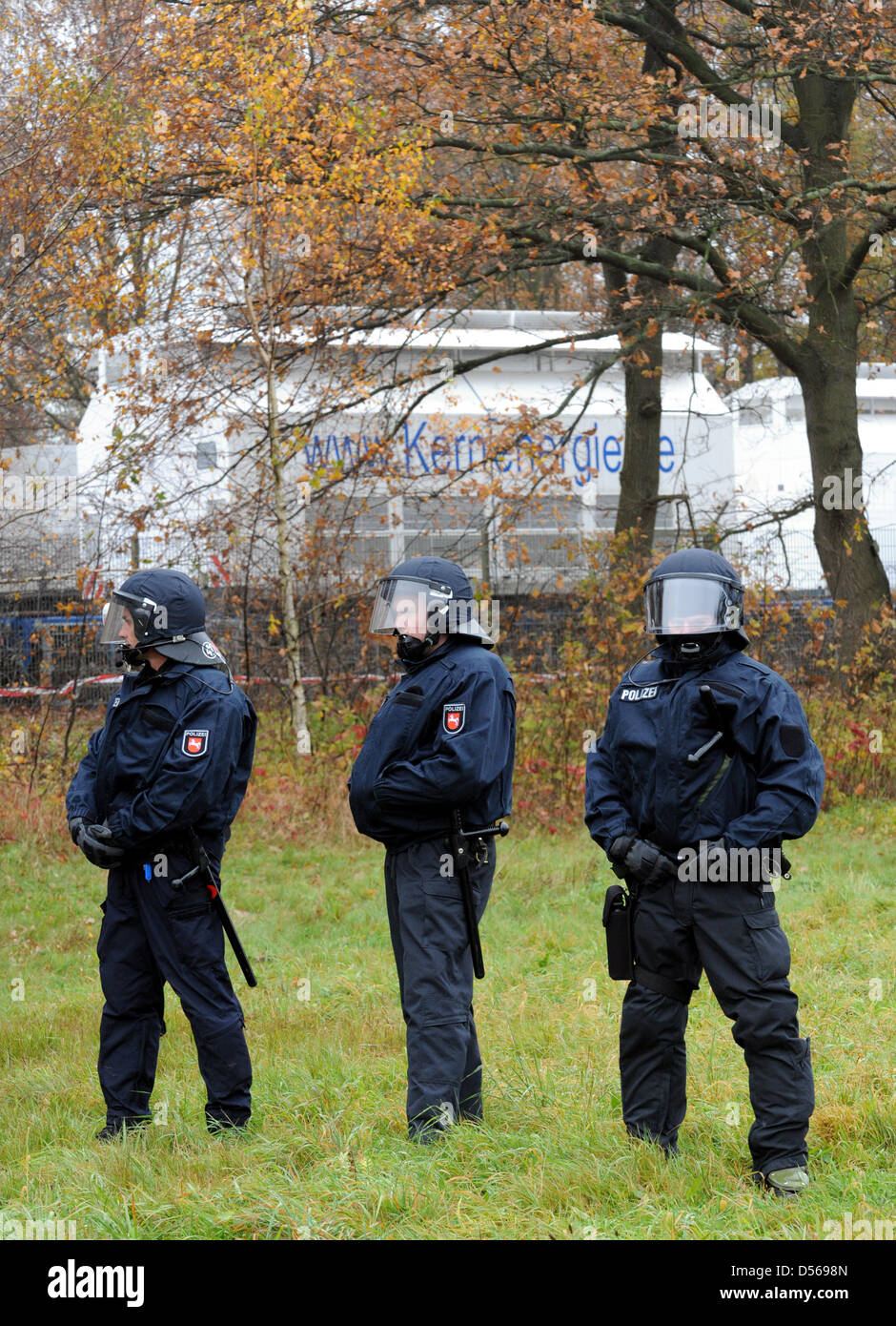 Police officers in riot gear guard the CASTOR transport arriving in ...