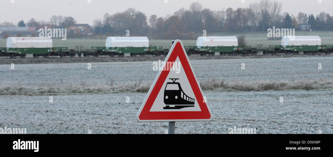 Police officers in riot gear guard the CASTOR transport arriving in ...