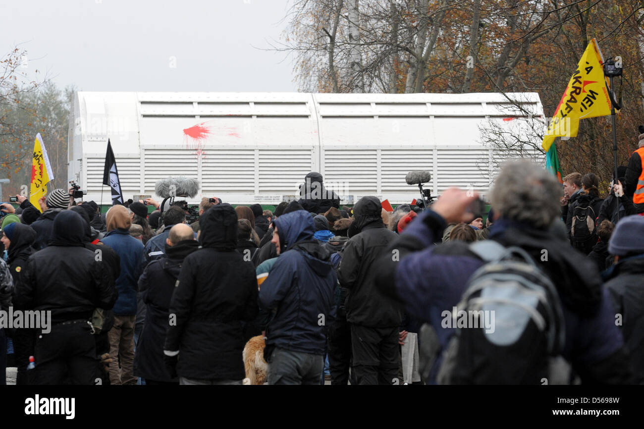Police officers in riot gear guard the CASTOR transport arriving in ...