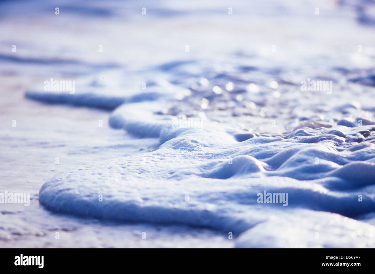 detail of waves washing up on beach Stock Photo - Alamy