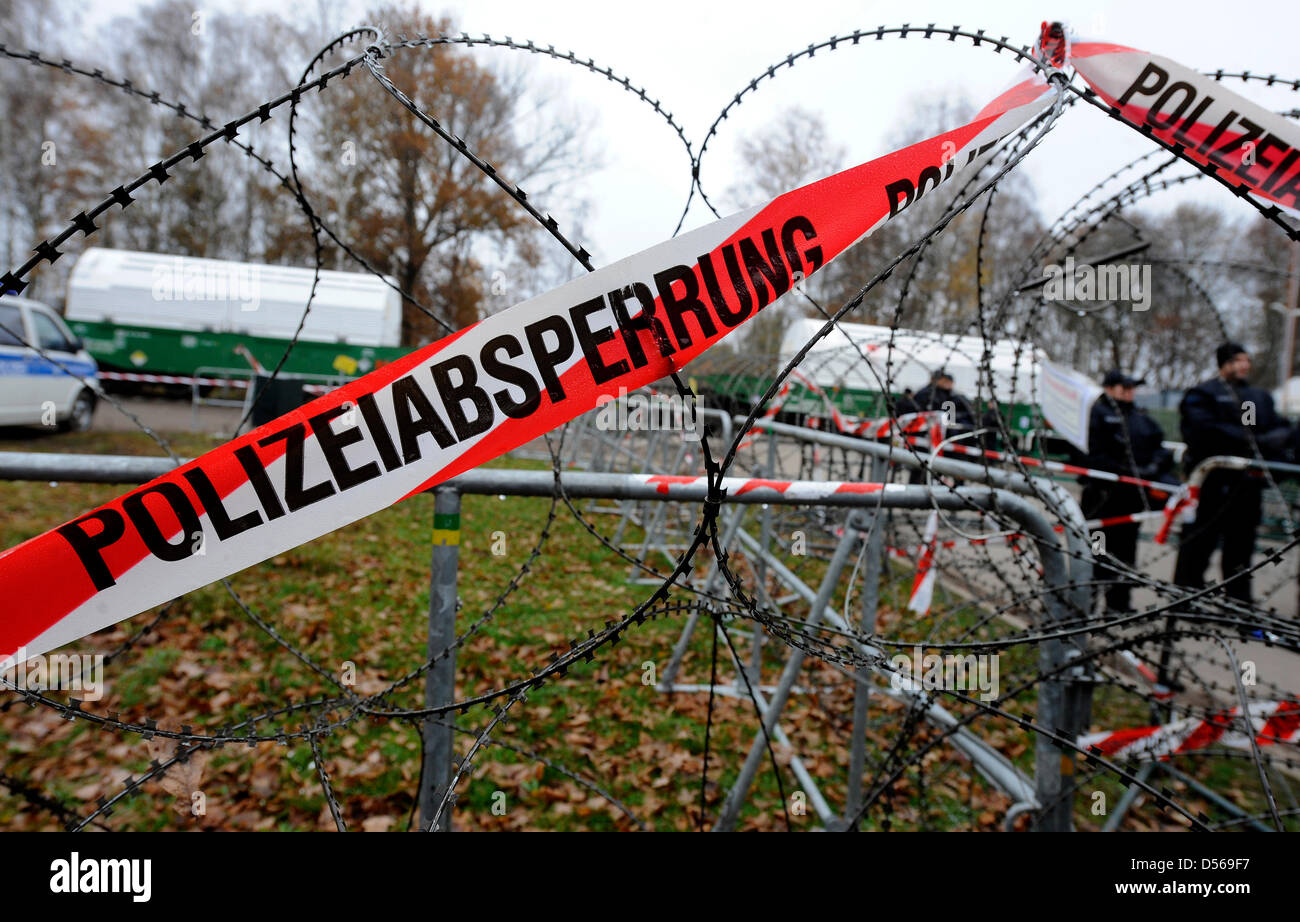 Police officers in riot gear guard the CASTOR transport arriving in ...