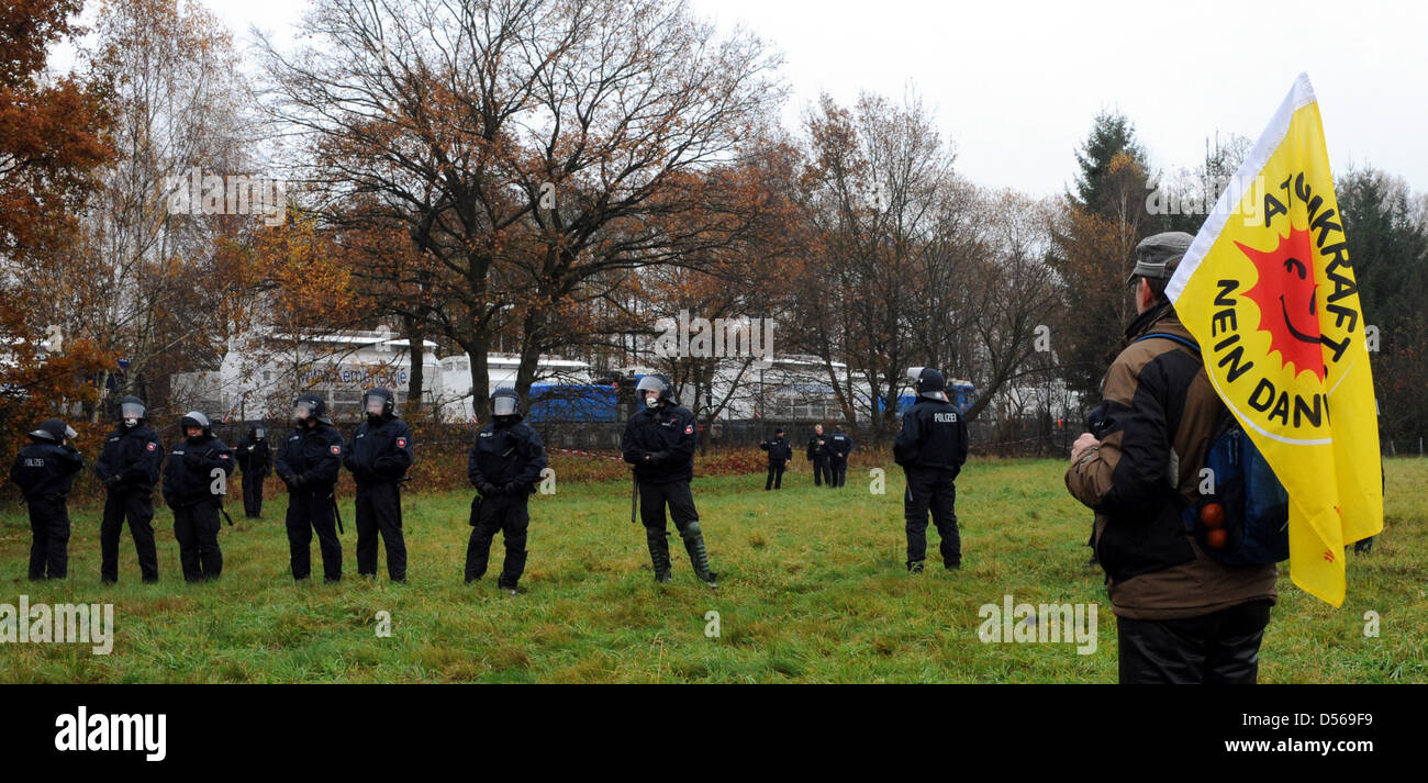 Police officers in riot gear guard the CASTOR transport arriving in ...