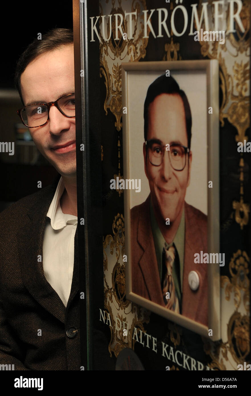 German comedian Kurt Kroemer poses with his platinum DVD of the ...
