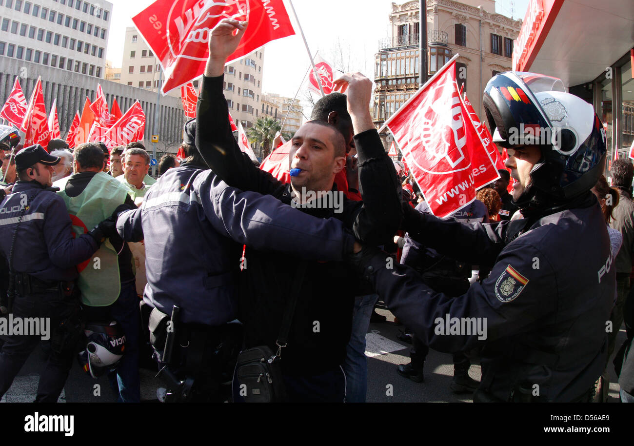 Demonstrators protest during a general strike day against cuttings on ...