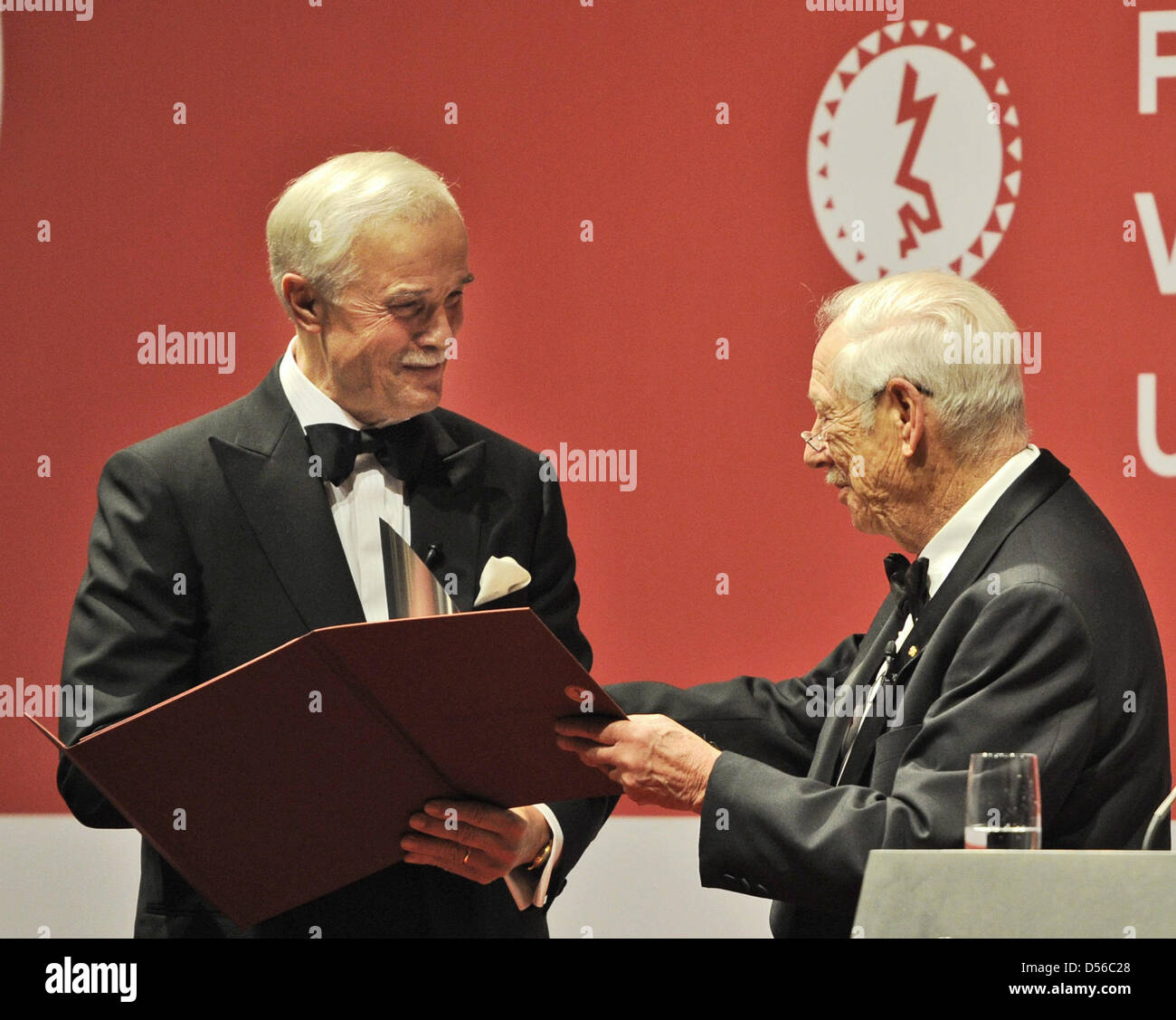 The Director of the Jewish museum Michael Blumenthal (R) awards ...
