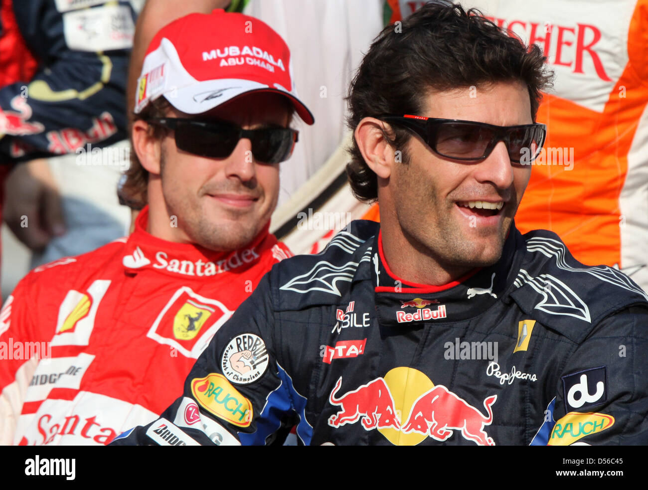 Australian driver Mark Webber (R) of Red Bull sits next to Spanish ...