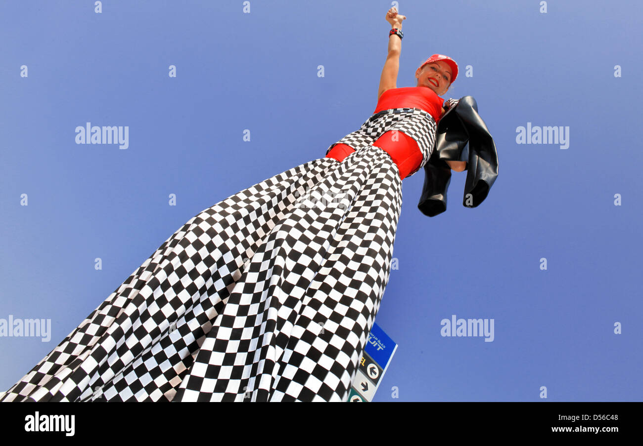 Artistes on stilts please the crowd before the title-decisive 2010 ...