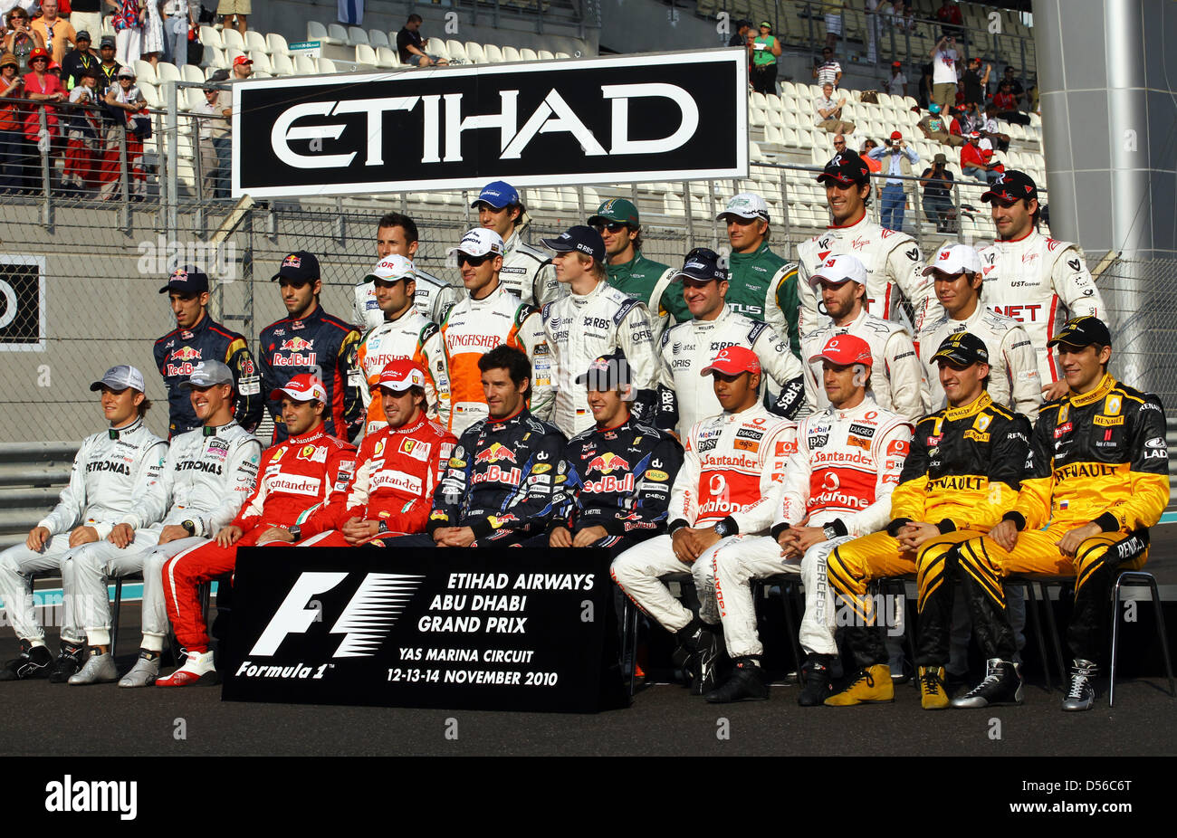 The drivers pose for a group photo before the start of the title ...