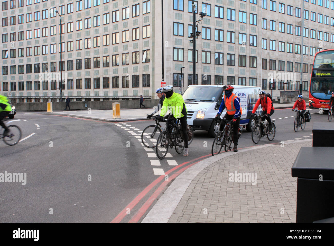 Cyclists and traffic entering a roundabout in London, England Stock ...