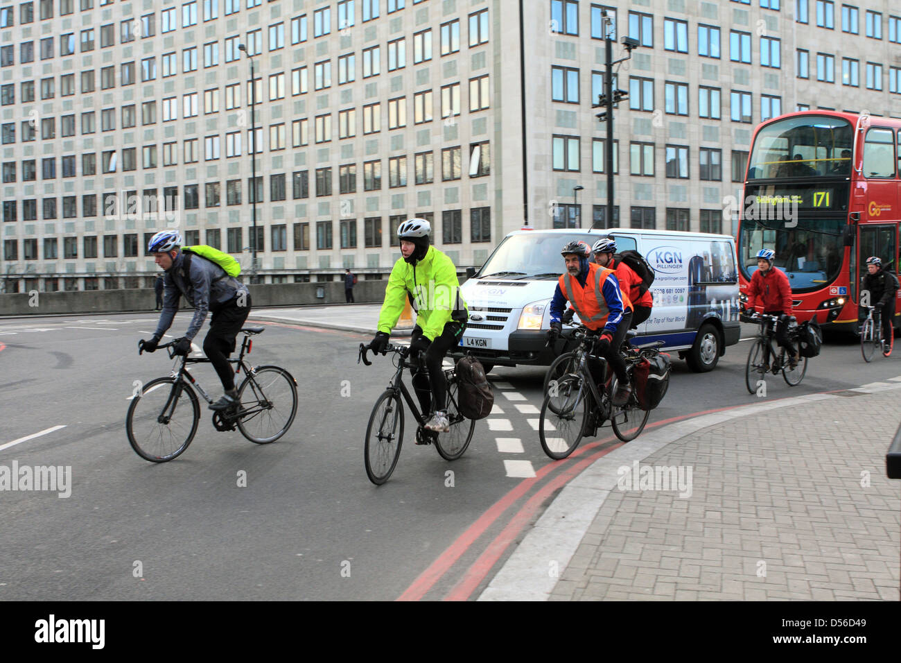 Cyclists and traffic entering a roundabout in London, England Stock ...
