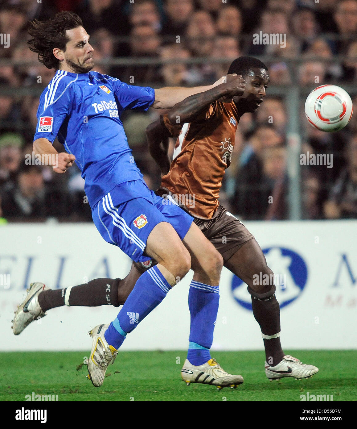St Pauli's Charles Takyi (R) and Leverkusen's Manuel Friedrich (L) vie ...