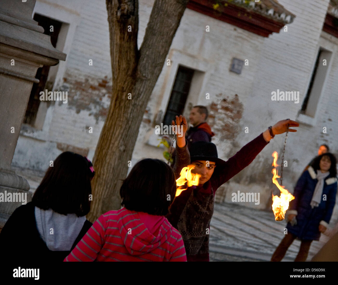 Female fire eating juggler entertainer performing at dusk in Mirador ...