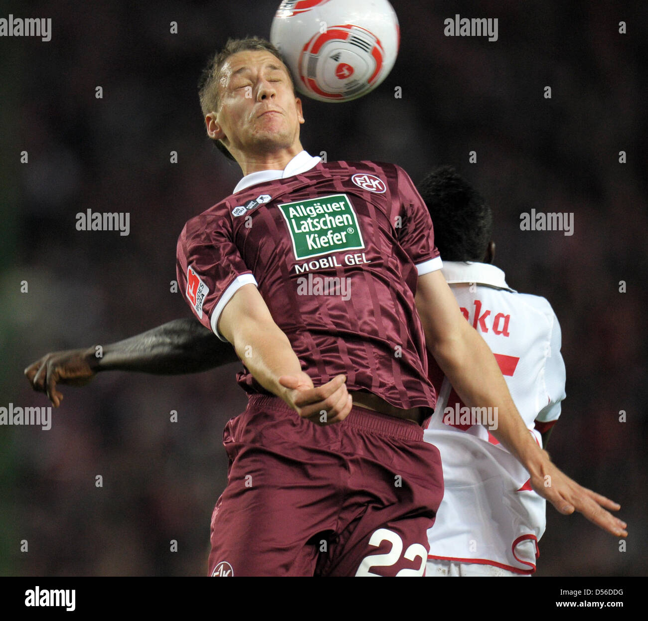 Stuttgart's Arthur Boka (R) and Kaiserslautern's Ivo Ilicevic (L) rise ...