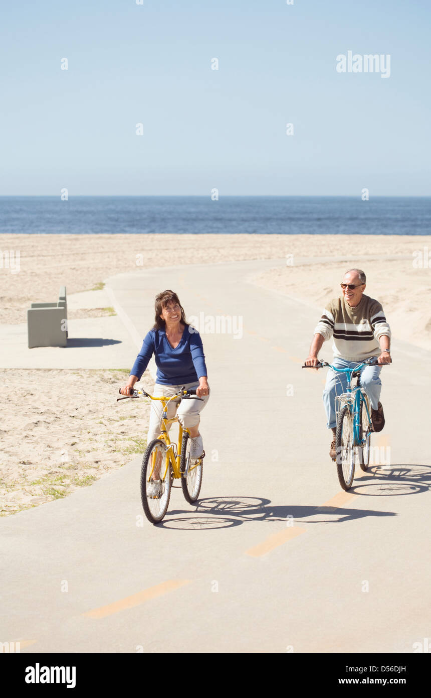 Hispanic man riding bike beach hi-res stock photography and images - Alamy