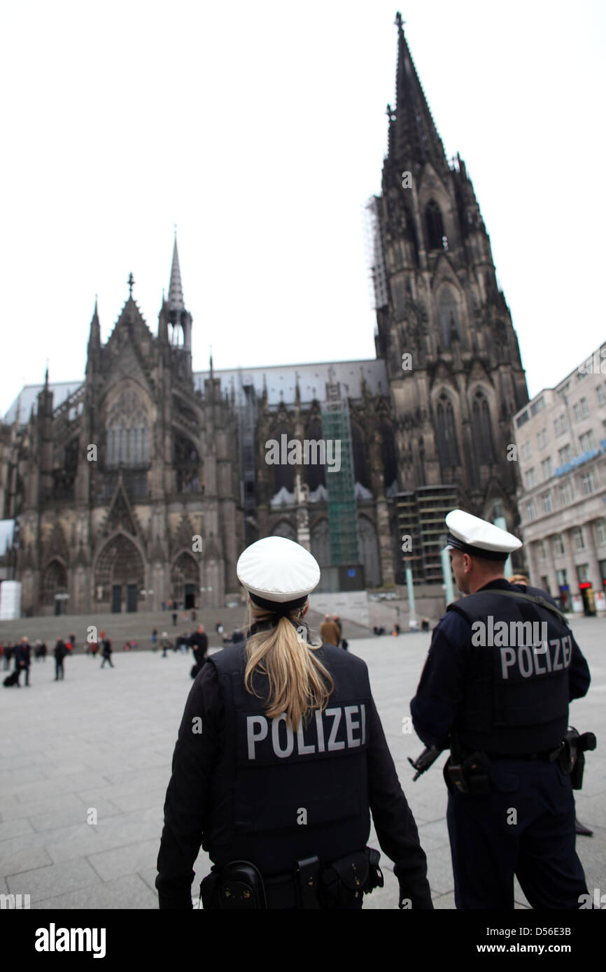 Police officers patrol at the Cologne Cathedral in Cologne, Germany, 17 ...