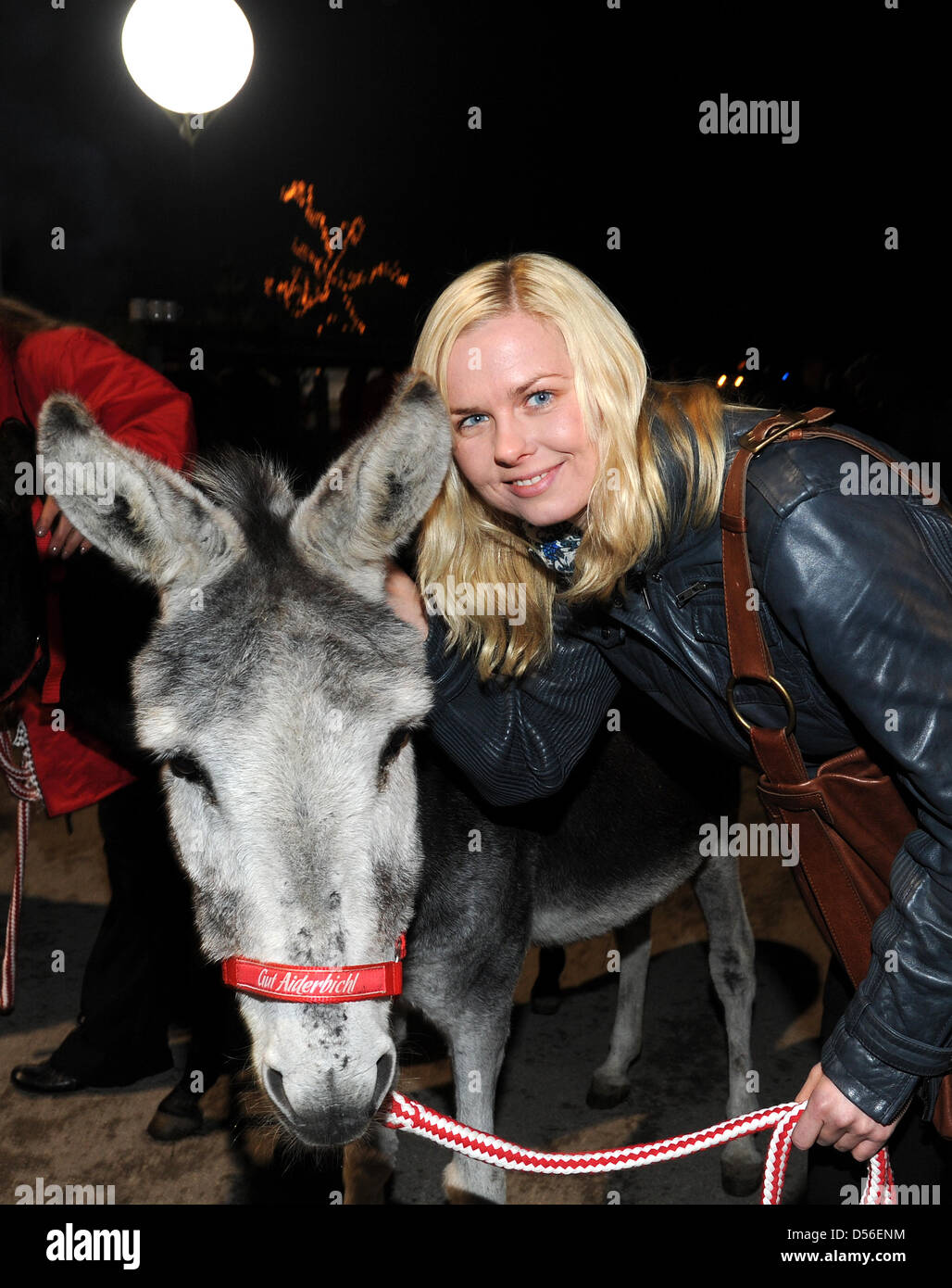 German swimming champion Britta Steffen smiles with a donkey at the ...