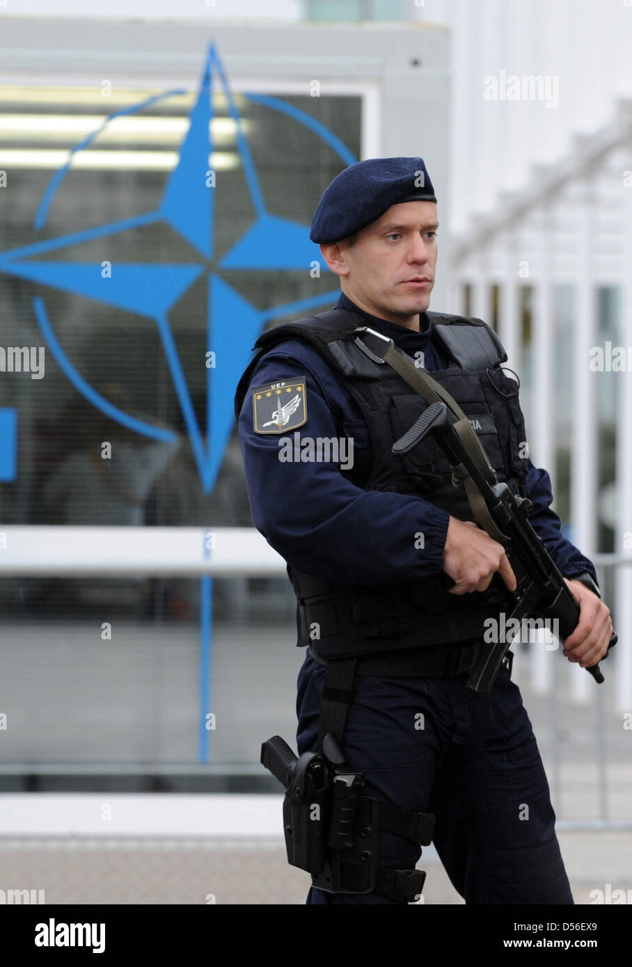 Police officers monitor the premises of the NATO Summit in Lisbon ...