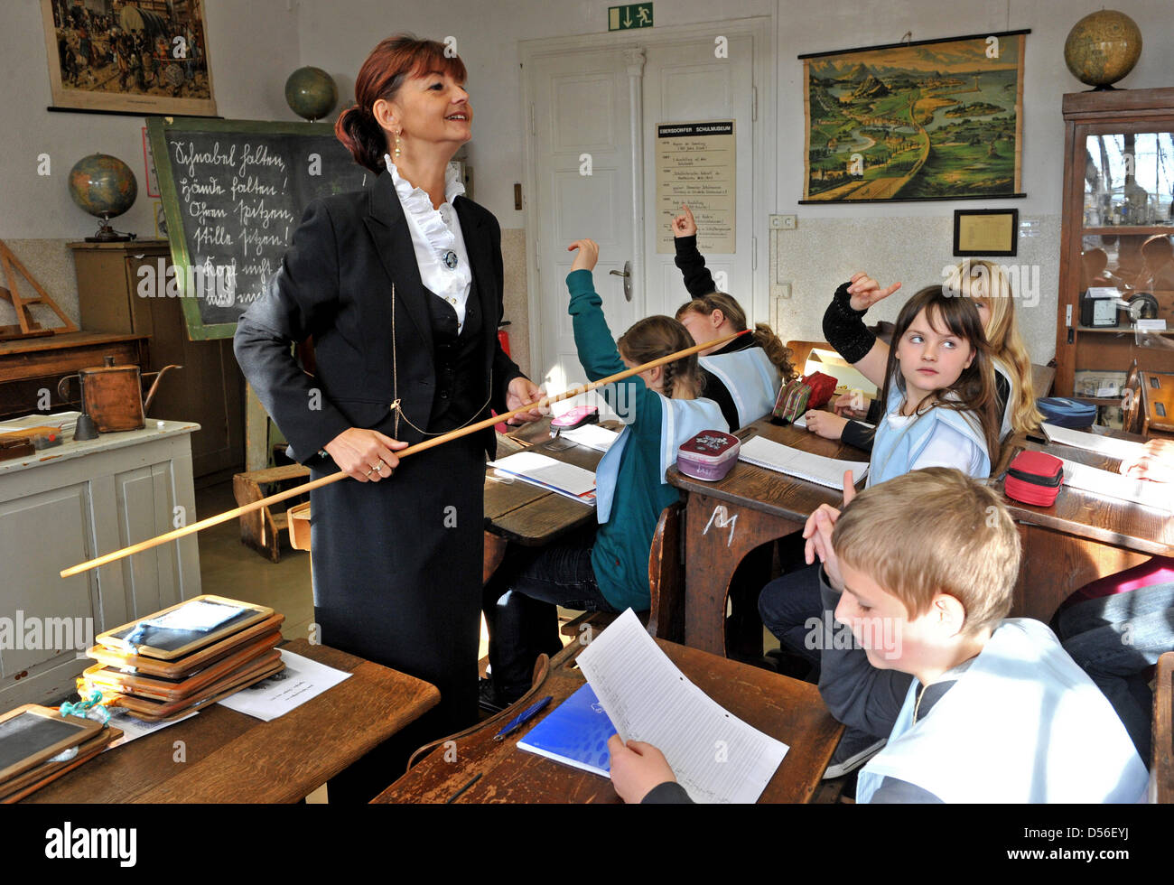 Birgit Raddatz (L) conducts a lesson in a historical class room of ...