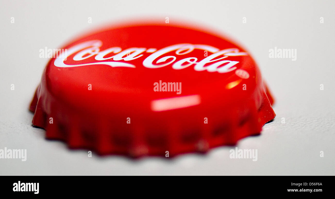 A picture taken on 15 November shows a red crown cork of Coca Cola in ...