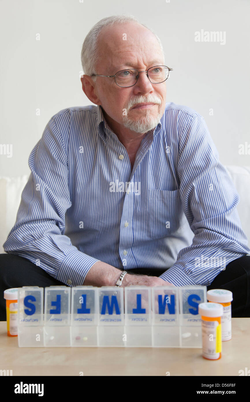 Man taking medication hi-res stock photography and images - Alamy