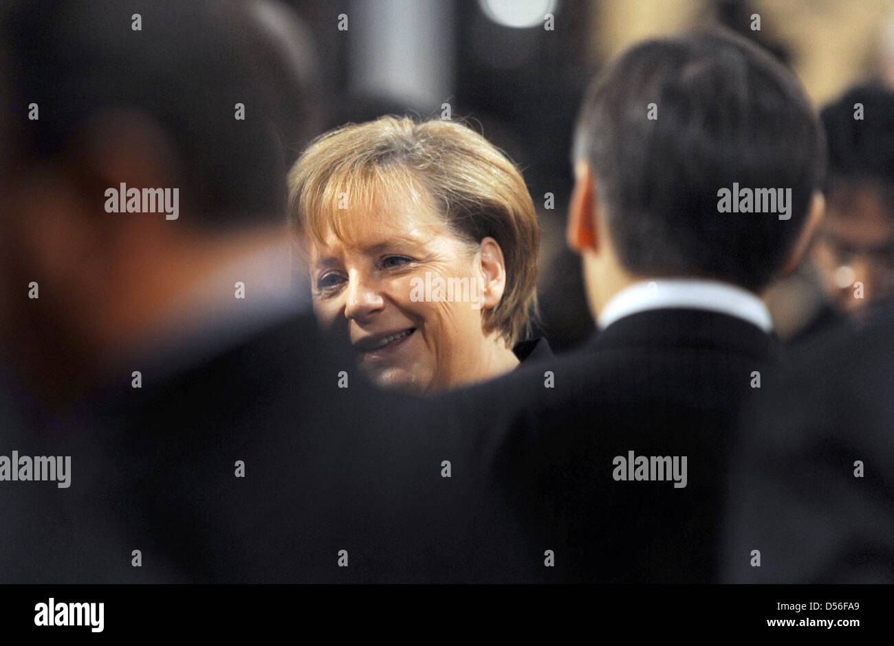 German Chancellor Angela Merkel talks before another session at the ...