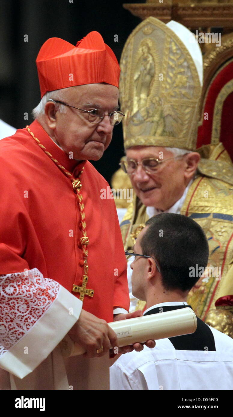 Bishop Walter Brandmueller(L) holds the promotion decree from Pope ...