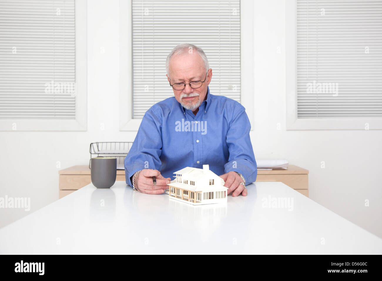 Businessman working model house hi-res stock photography and images - Alamy