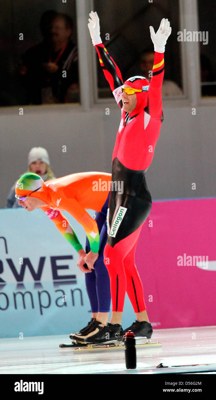 German speed skater Nico Ihles (R) celebrates his win in the men's ...