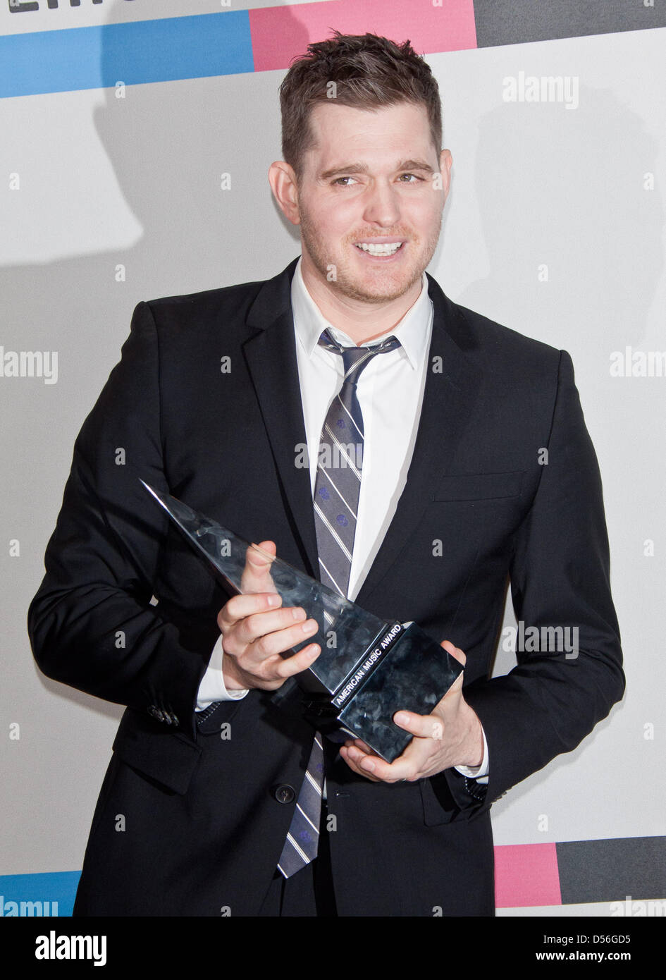 Canadian singer Michael Buble kisses his award for Favorite Adult ...