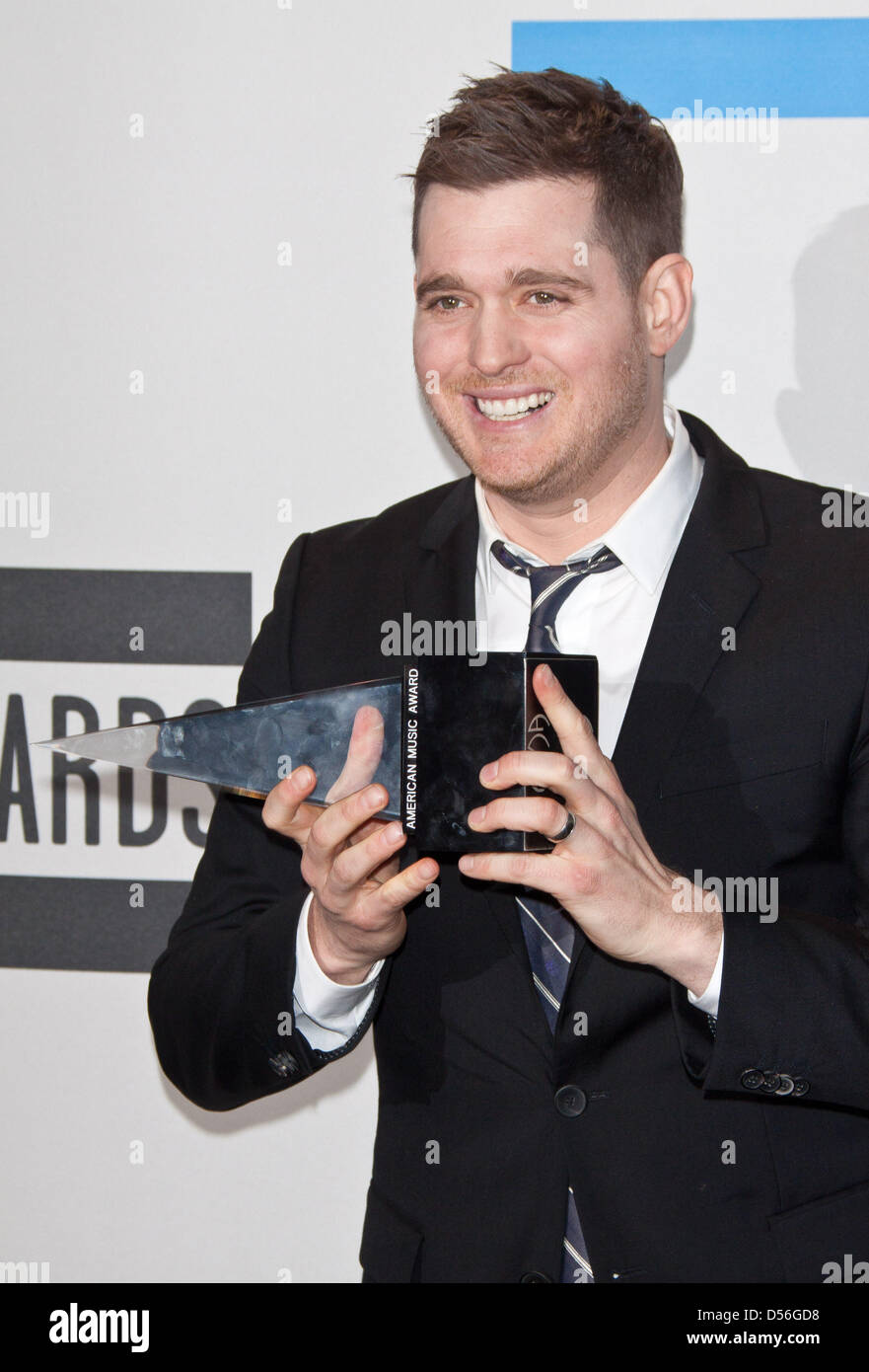 Canadian singer Michael Buble kisses his award for Favorite Adult ...